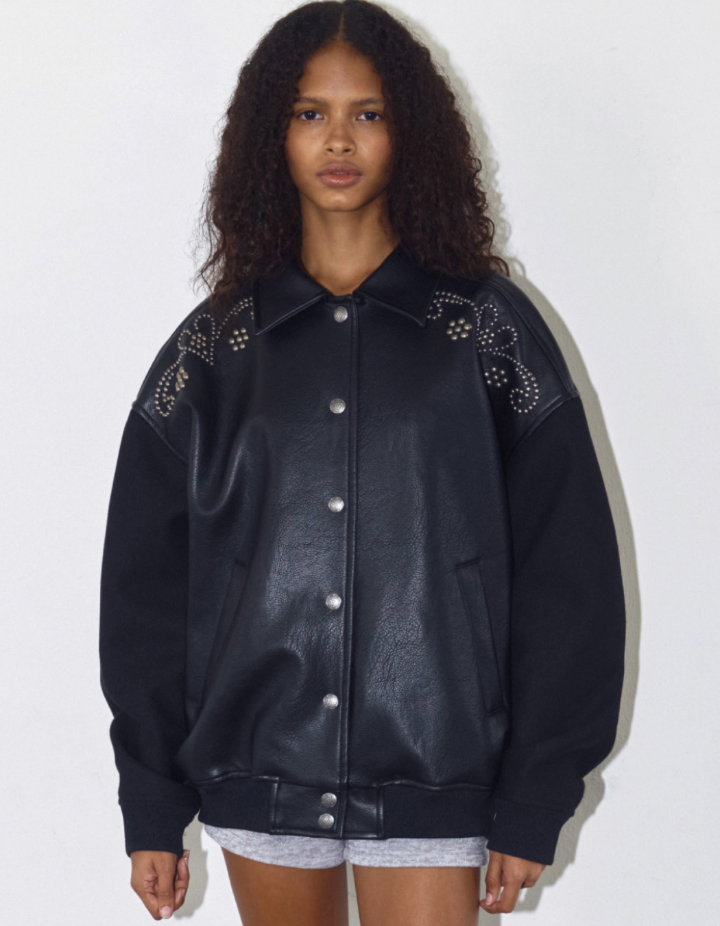 HEART STUDDED VARSITY JACKET_ONZI_EDITION, BLACK | polysooem
