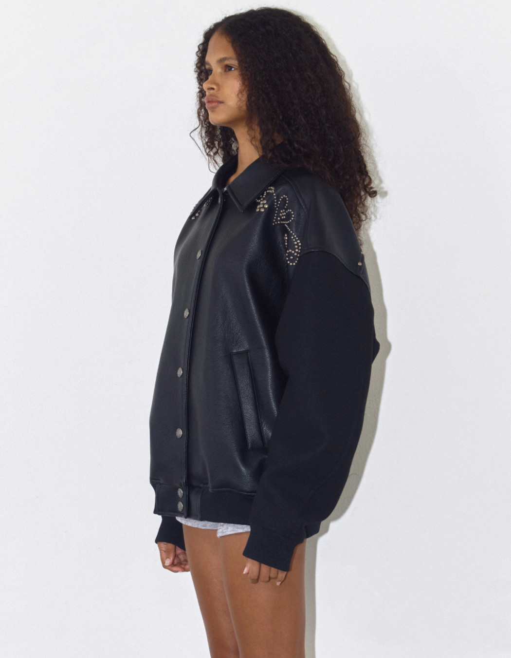 HEART STUDDED VARSITY JACKET_ONZI_EDITION, BLACK | polysooem